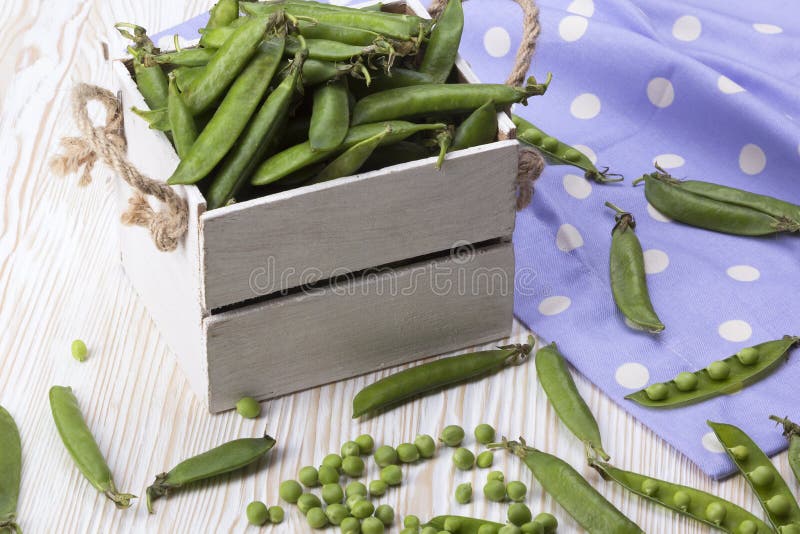 Green peas in a wooden box stock image. Image of ripe - 72531735