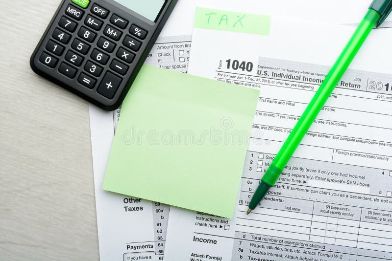 Green Pen and Calculator on Tax Form Editorial Stock Photo - Image of ...