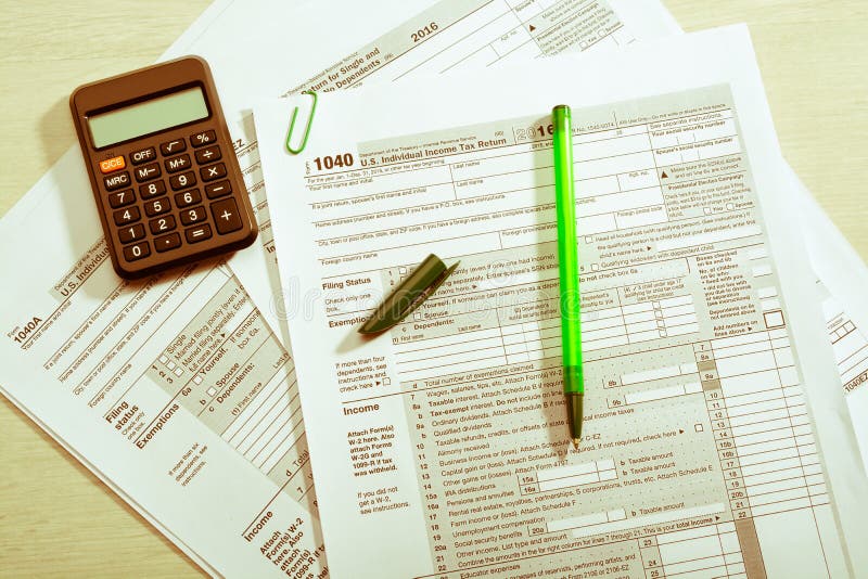 Green Pen and Calculator on Tax Form Editorial Photo - Image of ...