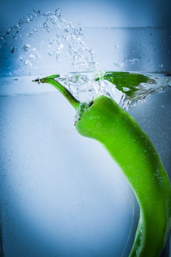 Green Pepper Splash stock photo. Image of pepperoni, salad - 28925690