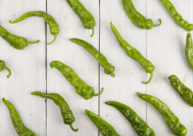 Green Pepperoni Peppers on the Wooden Table Stock Image - Image of ...