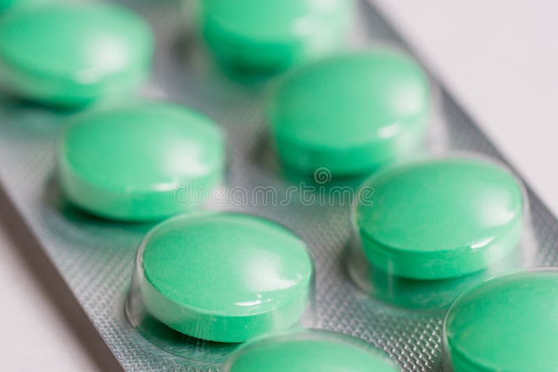 Green pills stock image. Image of drugstore, closeup - 56572519