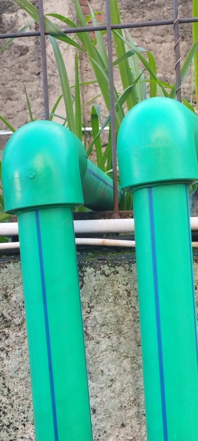 Green Pipe beside the River Stock Photo - Image of outdoor, river ...