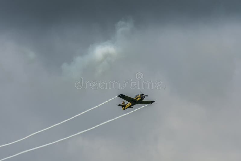 Green Plane with Propeller and White Smoke at a Air Show Editorial ...