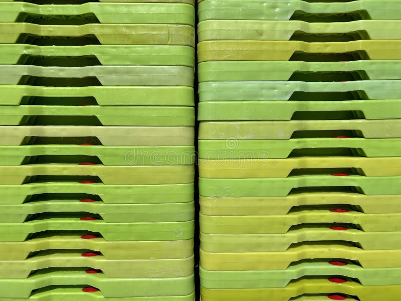 Green Plastic Boxes, Folded and Stacked To Form a Pattern Stock Photo ...