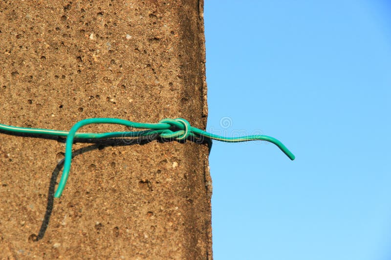 Green Plastic Cable Sheath Tied To Electric Pole Stock Photo - Image of ...