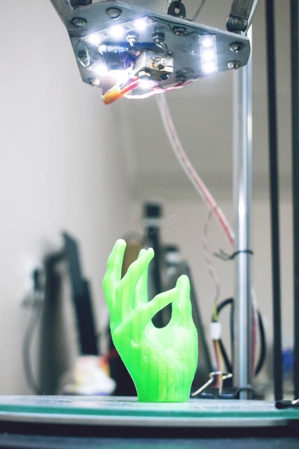 Green Plastic 3D Printed Human Hand Stands in Three-dimensional Printer ...