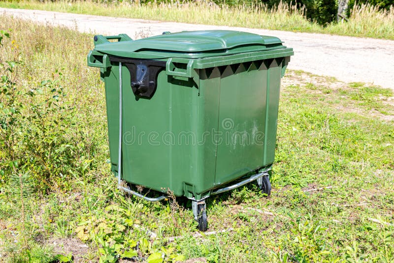 Green Plastic Garbage Container at the Outdoors Stock Image - Image of ...
