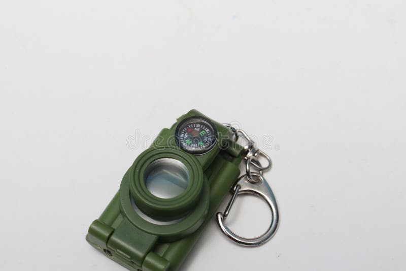 The Green Plastic Mini Keychain Has a Small Compass on the End. Stock ...