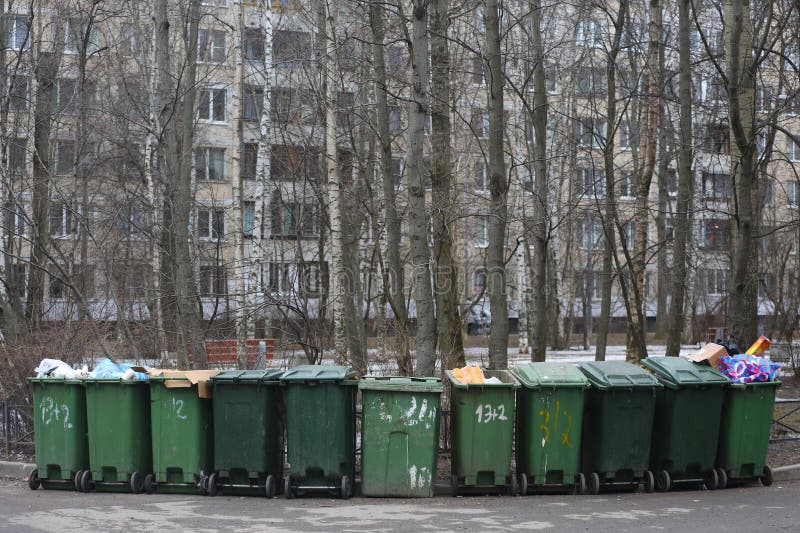 Green Plastic Mobile Containers with Garbage in the Courtyard of a ...