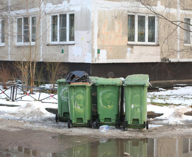 Green Plastic Mobile Containers with Garbage in the Courtyard of a ...