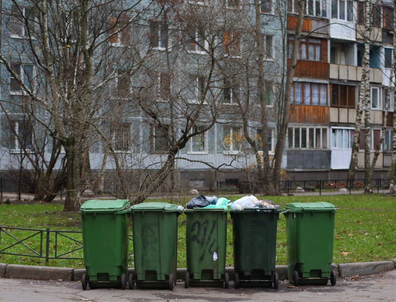 Green Plastic Mobile Containers with Garbage in the Courtyard of a ...