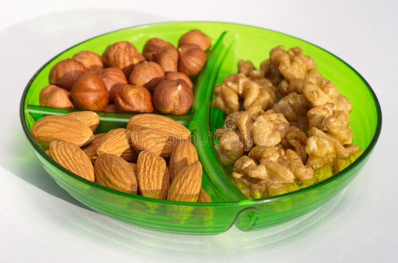 Green Plastic Plate with Different Nuts Stock Image - Image of sections ...