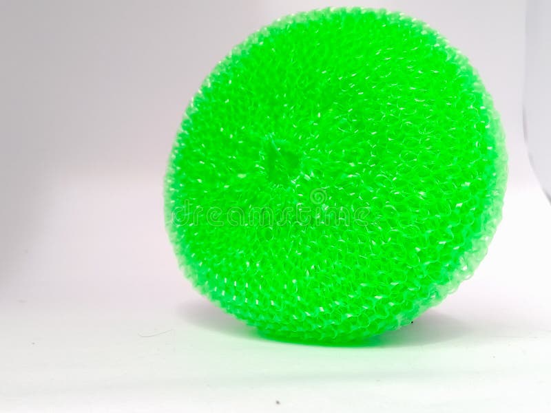 A Green Plastic Scrubber Placed Isolated Vertically on White Background ...