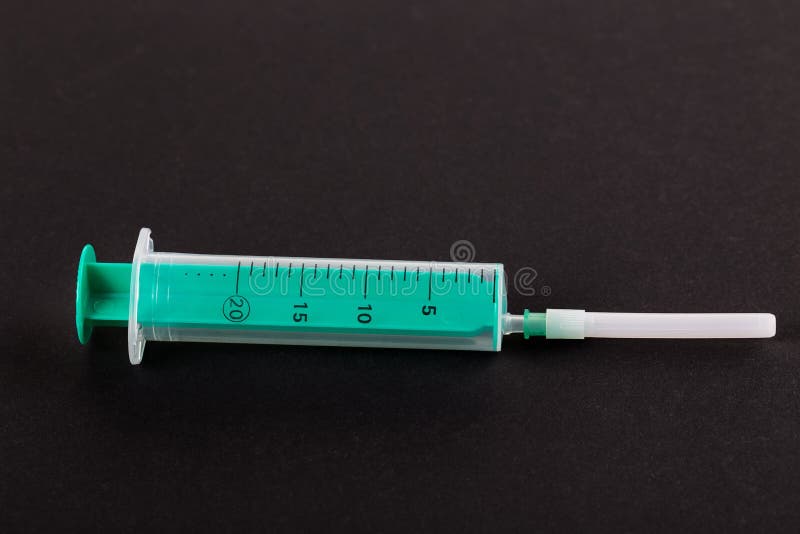 Green plastic syringe. stock photo. Image of syringe - 68058732