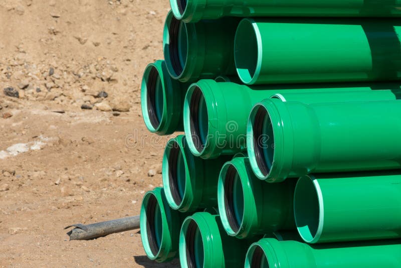 Green Plastic Tubes on a Construction Site Stock Image - Image of ...
