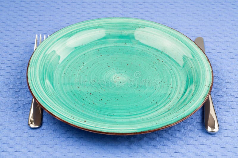 Green plate stock photo. Image of closeup, kitchenware - 199597470