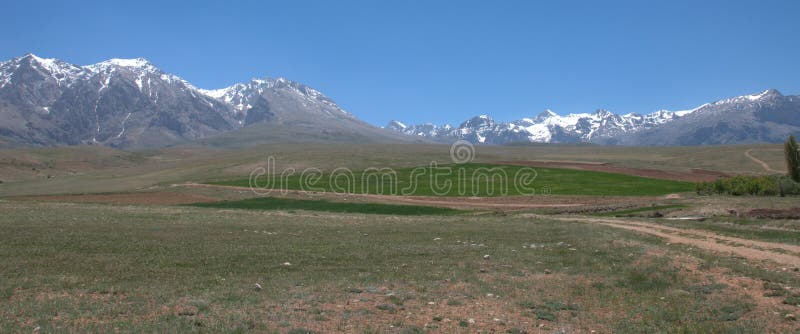 Green Plateau and Rocky Mountains Stock Image - Image of mountain ...