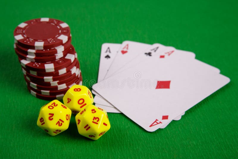 Green Poker Game Table with Chips, Game Cards and Dice Stock Photo ...