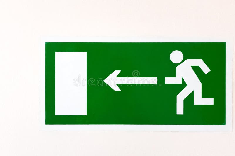A Green Poster DIRECTION TO EVACUATION EXIT LEFT Stock Photo - Image of ...
