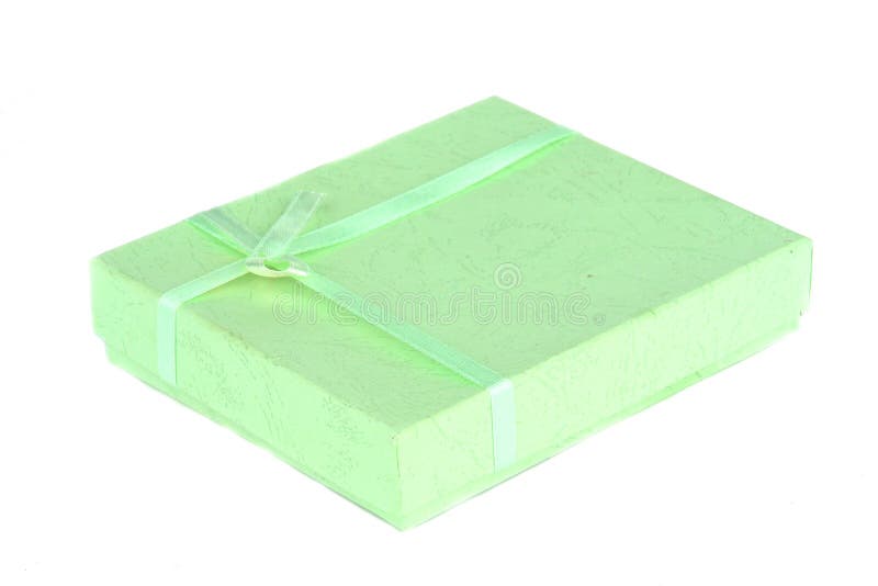 Green Present with Red Ribbon Over Snow Stock Photo - Image of modern ...