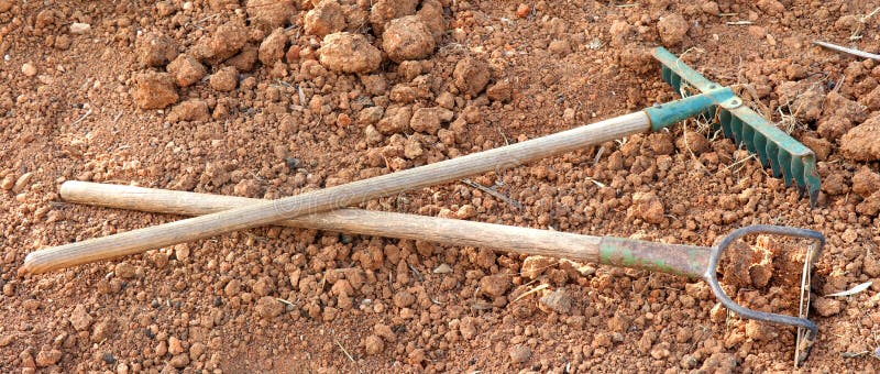 Green Rake and Hoe on the Brown Soil. Stock Image - Image of cultivate ...