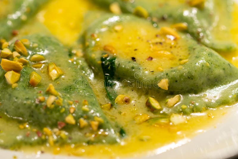 Green Ravioli with Spinach and Nuts in a Plate Stock Image - Image of ...