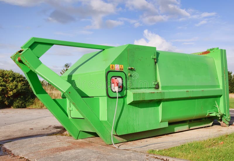 Green Recycle Skip with Electric Compressor Stock Photo - Image of ...