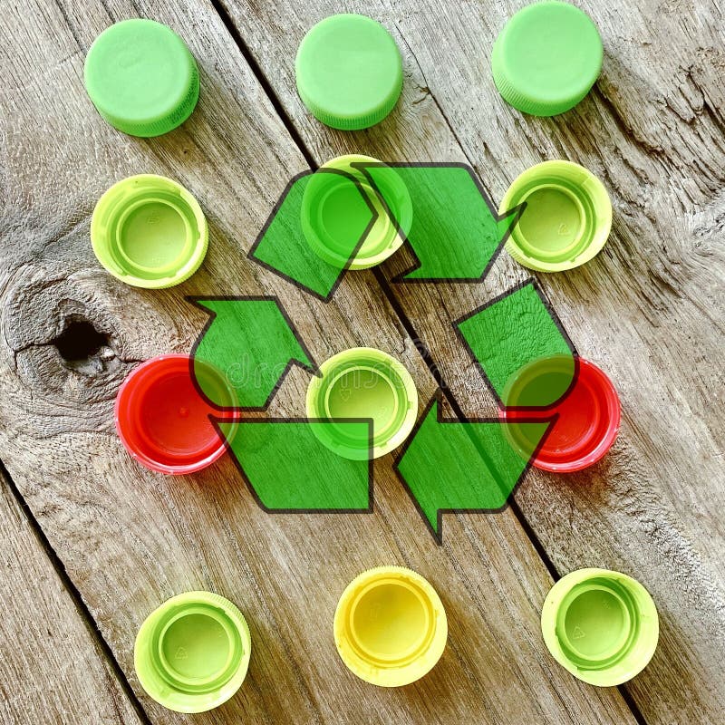 Green Recycling Icon on the Plastic Caps of Drinking Bottles on Old ...