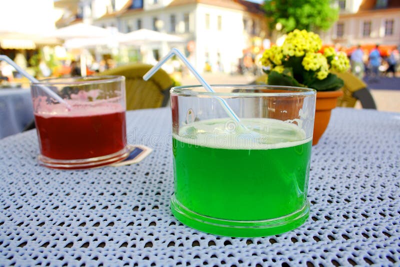 Green and Red Cocktail with Straw in Restaurant, Soft Focus Stock Image ...