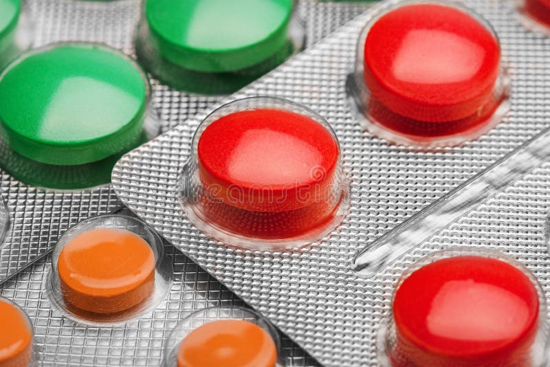 Green, Red and Orange Medical Pills in Plastic Packaging Silver Stock ...