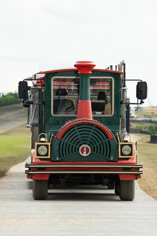 A Green and Red Train is Parked on a Road Stock Image - Image of museum ...