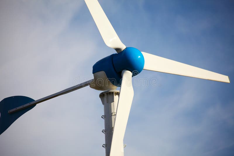 Green Renewable Energy Concept - Wind Generator Turbines on Blue Stock ...