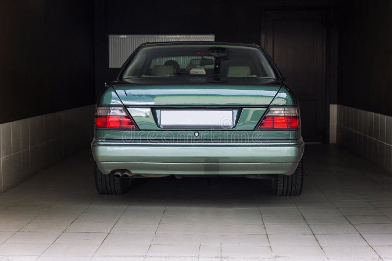 Green Retro Car in the Garage. Back View Stock Image - Image of garage ...