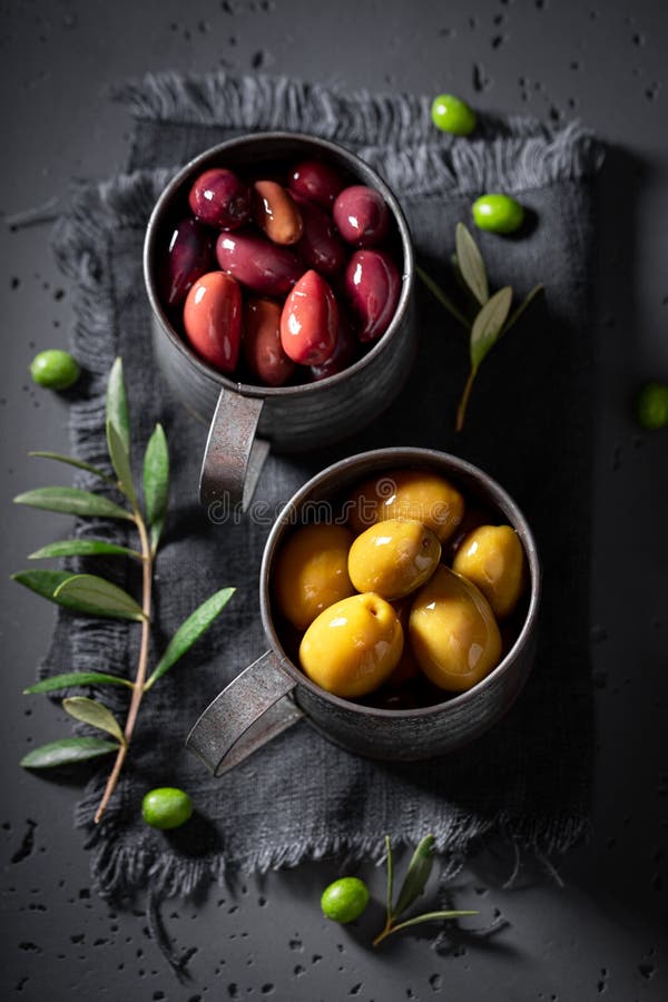 Green and Ripe Olives with Mortar and Twig Stock Photo - Image of food ...
