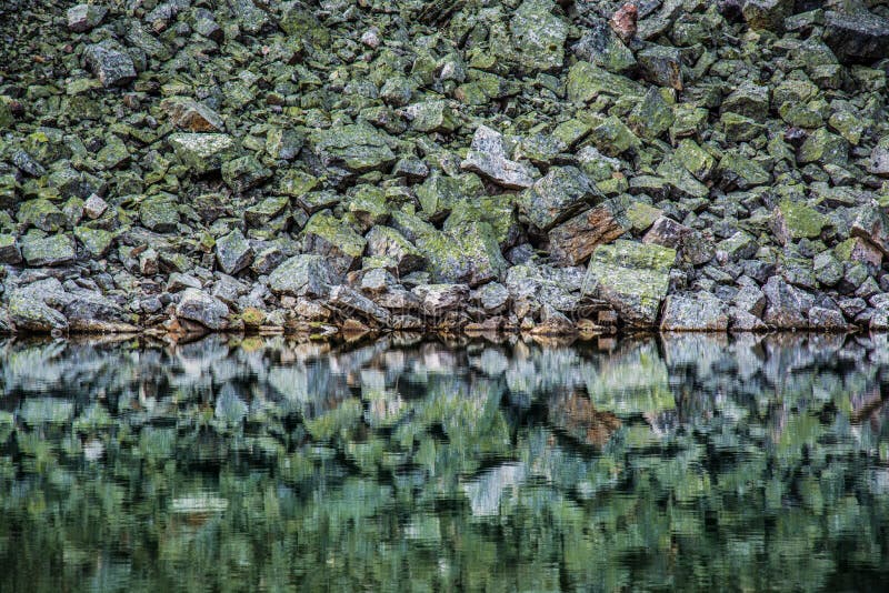 Green Rocks and Their Reflection Stock Photo - Image of stones, rock ...
