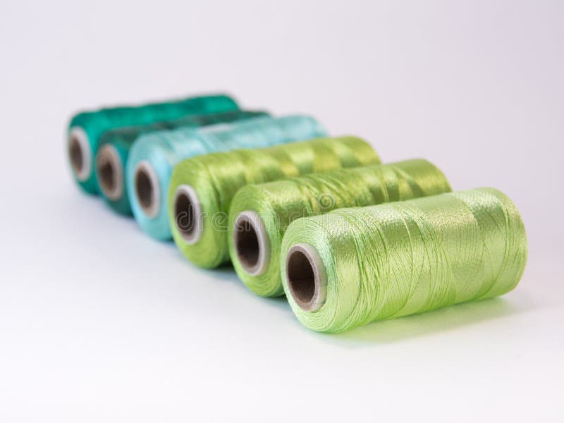 Green rolls of thread. stock photo. Image of pieces, background - 65807920