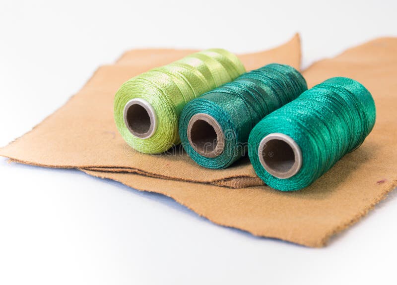 Green rolls of thread. stock photo. Image of yellow, leather - 65807882