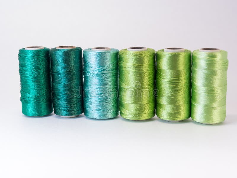 Green rolls of thread. stock photo. Image of sewing, pieces - 65808022