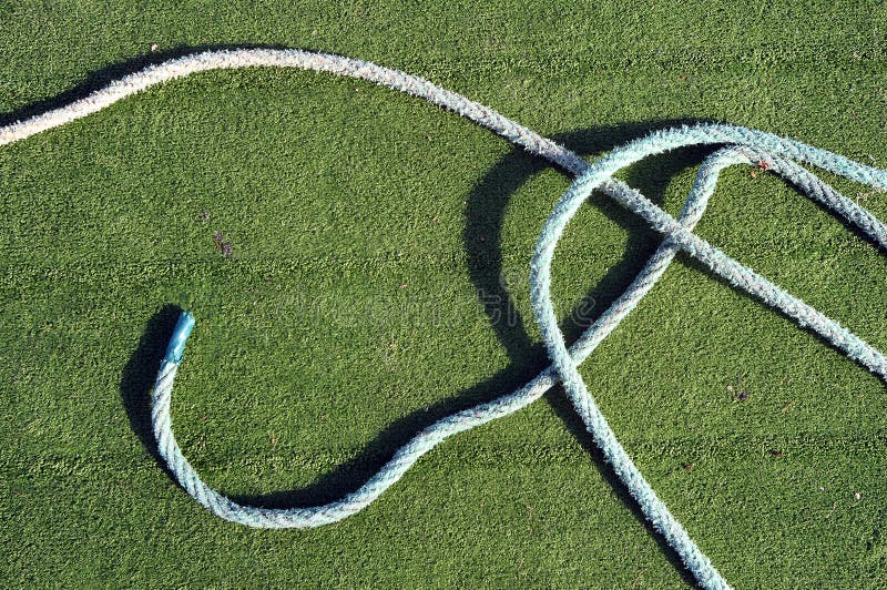 Green rope on green lawn stock photo. Image of rope, grass - 78793280