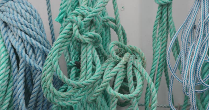 Green Ropes Coiled on Harbor Dock Stock Video - Video of tied, cord ...