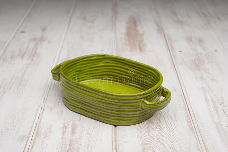 Green Rounded Rectangular Deep Dish on White Wooden Panel Stock Image ...