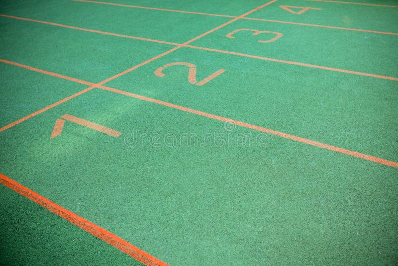 Green running track stock image. Image of textured, orange - 26171939