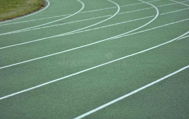 Green Running Track with White Lines and Green Grass. Stock Photo ...