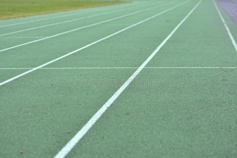 Green Running Track with Footpath in Right Side and Green Grass in Left ...