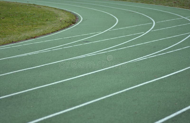 Green Running Track with Footpath in Right Side and Green Grass in Left ...