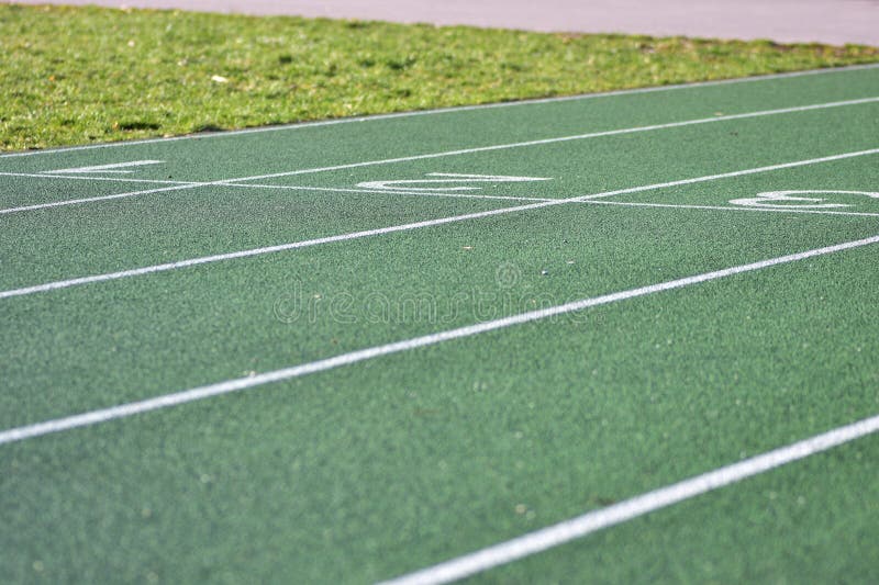 Green Running Track with White Lines and Numbers. Stock Image - Image ...