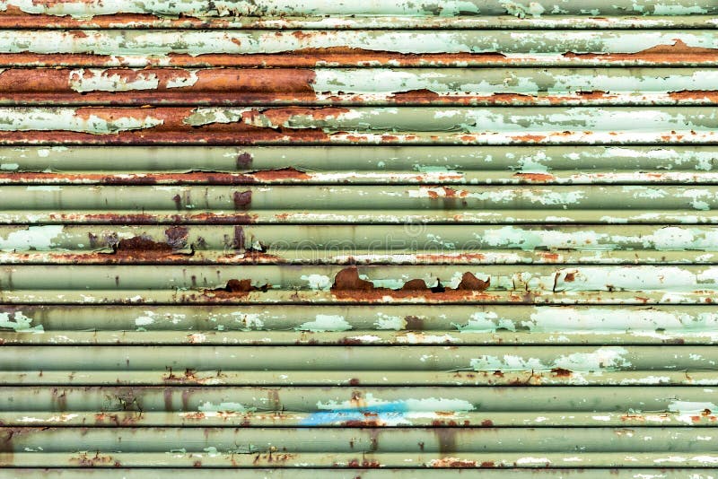 Green rusty roller shutter stock photo. Image of detail - 111547220