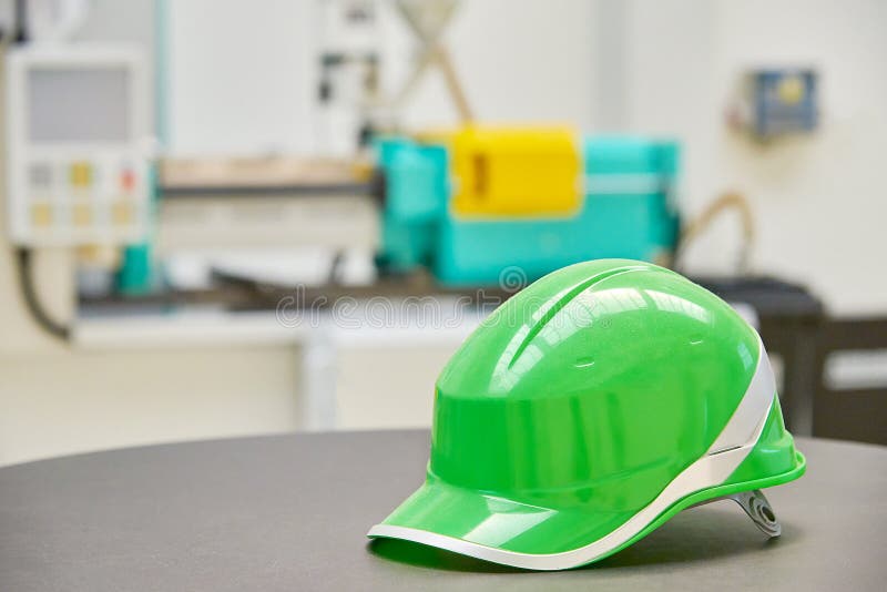 Green Safety Helmet on Industrial Background Stock Image - Image of ...