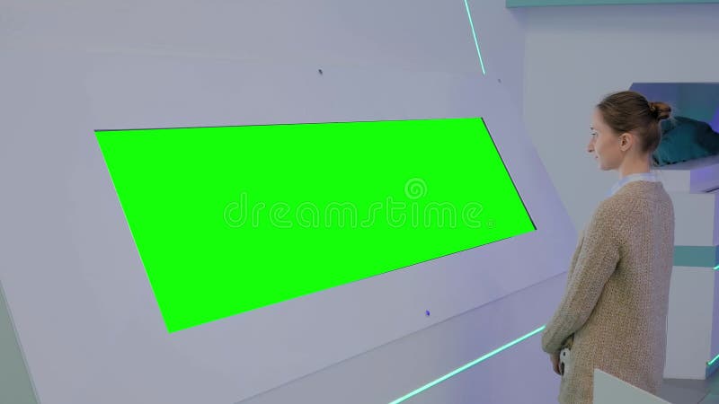 Green Screen Concept - Woman Looking at Blank Interactive Green Display ...